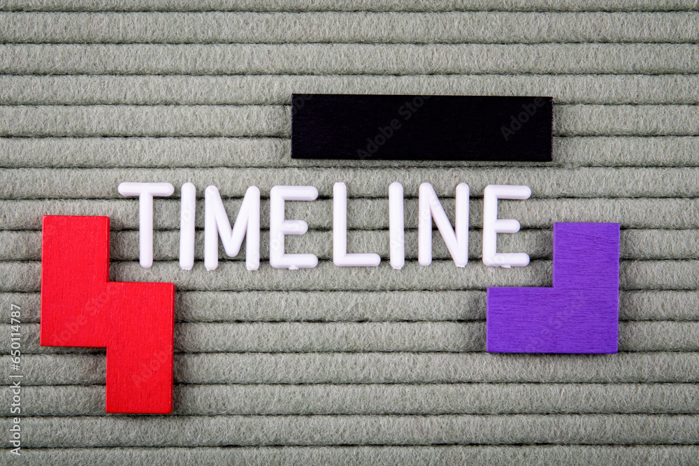 TIMELINE Concept. White letters of the alphabet on a green background ...