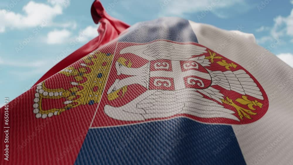 Wavy flag of Serbia blowing in the wind in slow motion. Waving official ...