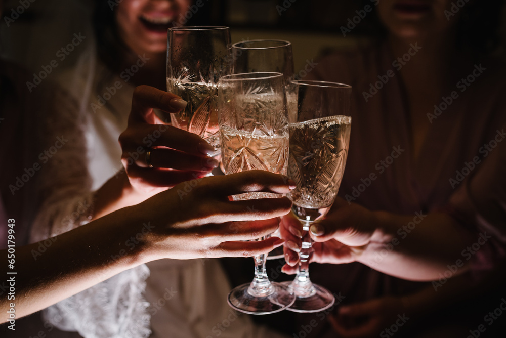 Cheers. People toast. Females cheering with champagne. Girls drink ...
