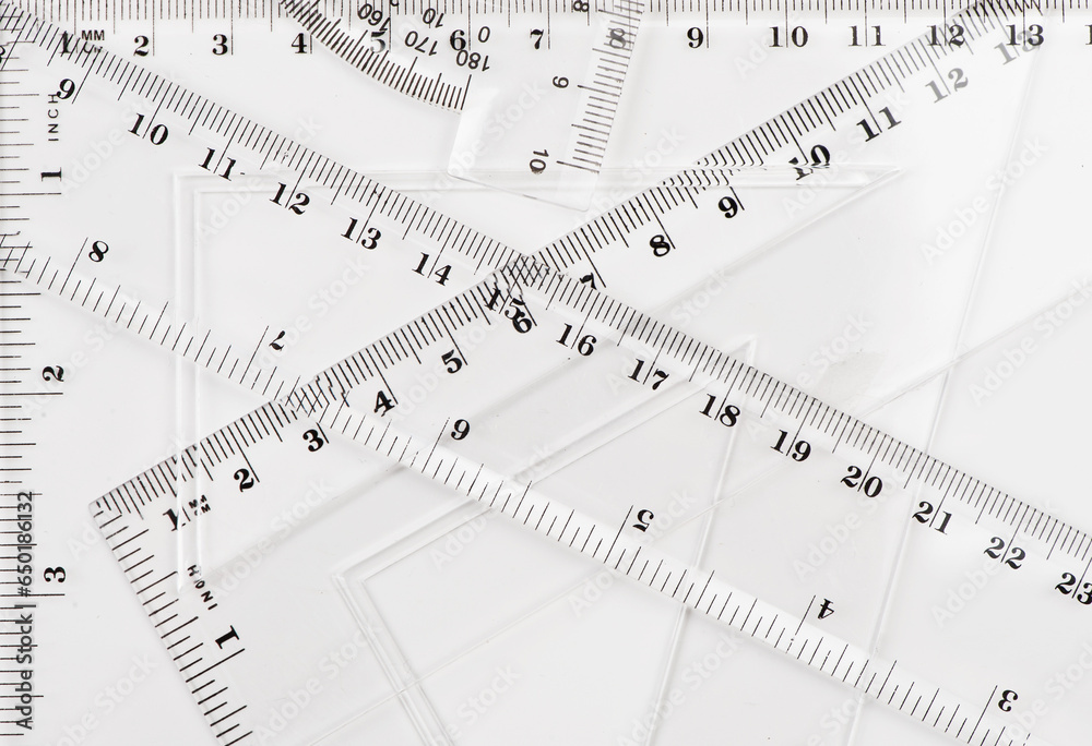 school background with set of transparent rulers on white background ...