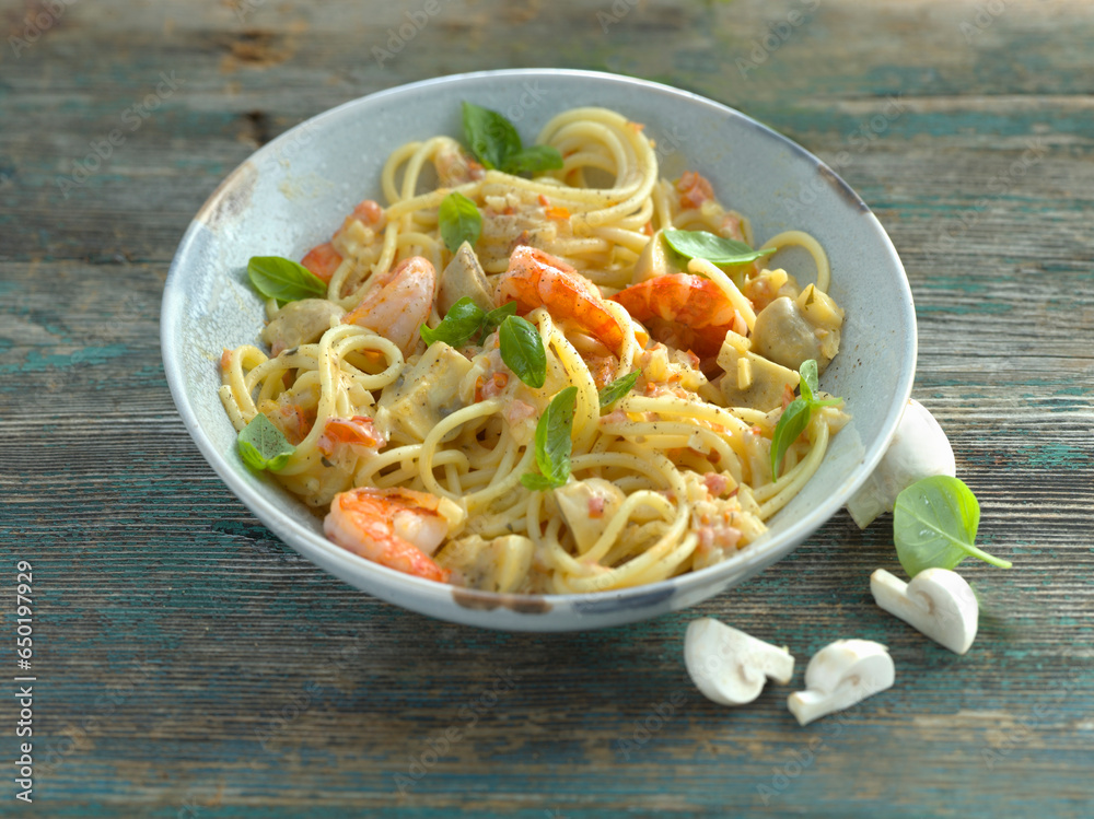 Spaghetti with prawns and mushrooms Stock Photo | Adobe Stock