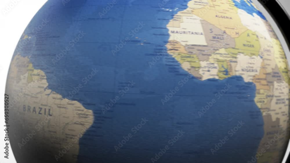 Atlas map of the world globe spinning zooming in and focusing on the ...