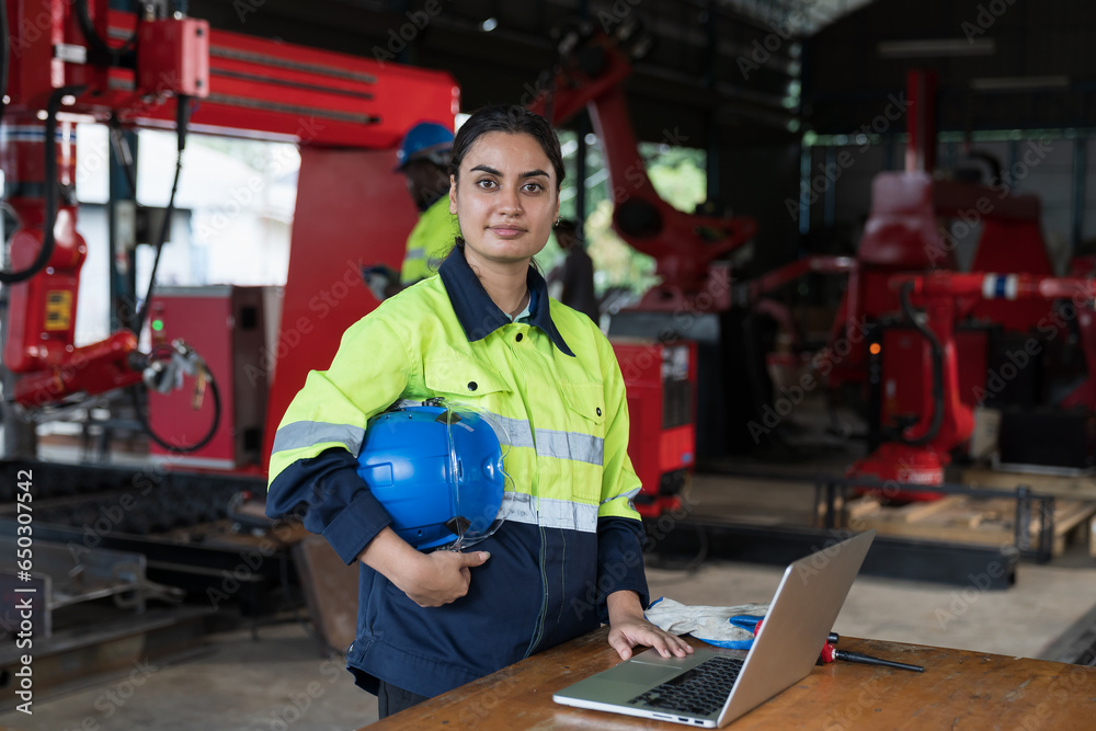 Female engineer worker working with laptop computer for maintenance ...