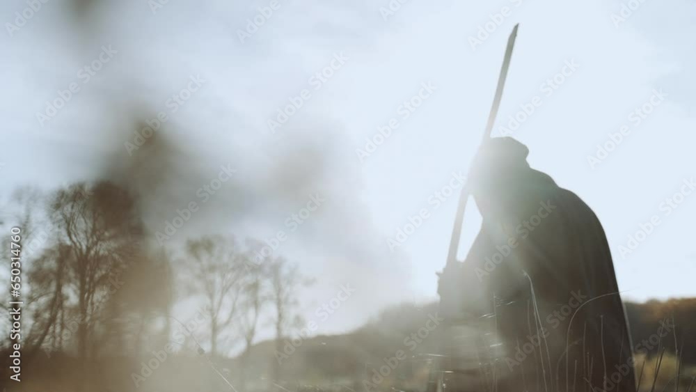 Amazing image of a witch.A woman with a stick in her hands, dressed in ...