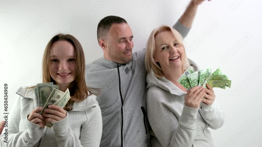 happy rich family dollars and euros in the hands of mom daughters dad ...