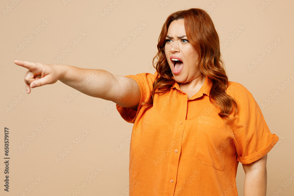 Side view young angry sad ginger chubby overweight woman wear orange ...
