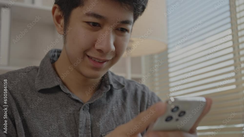 Man typing message on mobile phone with smiling face, Digital ...
