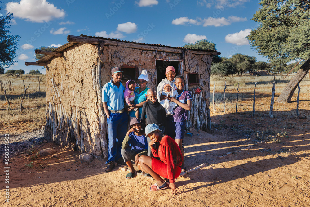 large happy african family, smiling parents hugging and holding the ...