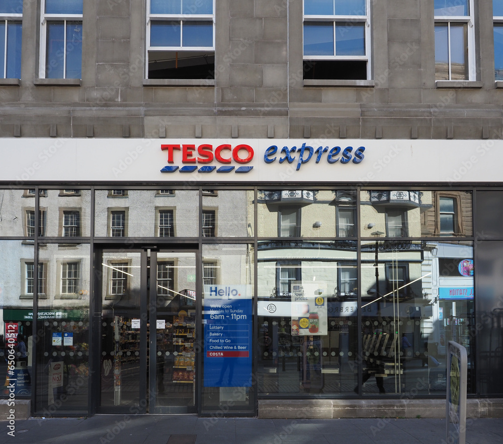 Tesco express shopfront sign in Dundee Stock Photo | Adobe Stock