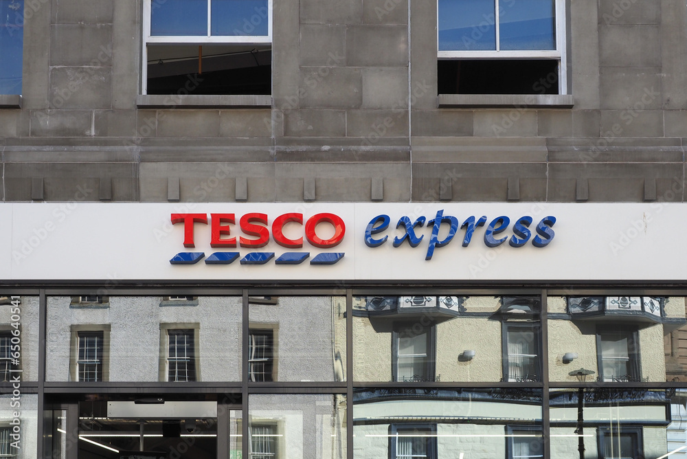 Tesco express shopfront sign in Dundee Stock Photo | Adobe Stock