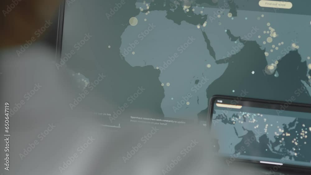 Global cyber attack with world map on computer and mobile phone screen ...