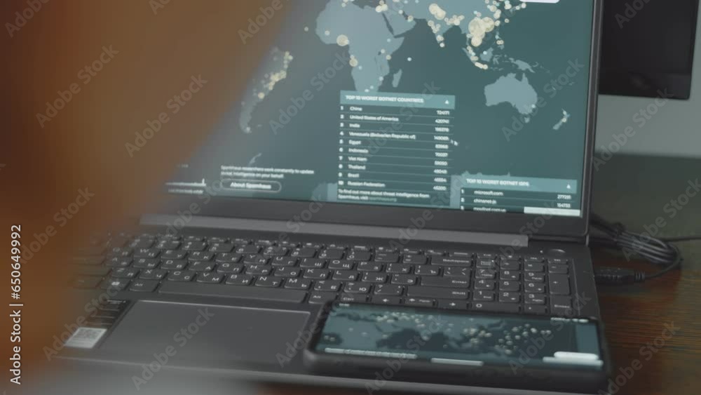 Global cyber attack with world map on computer and mobile phone screen ...