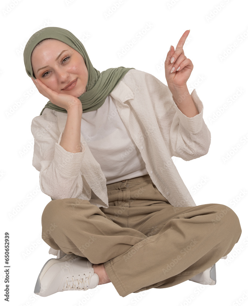 Pointing finger, full body muslim woman in hijab sit floor pointing ...