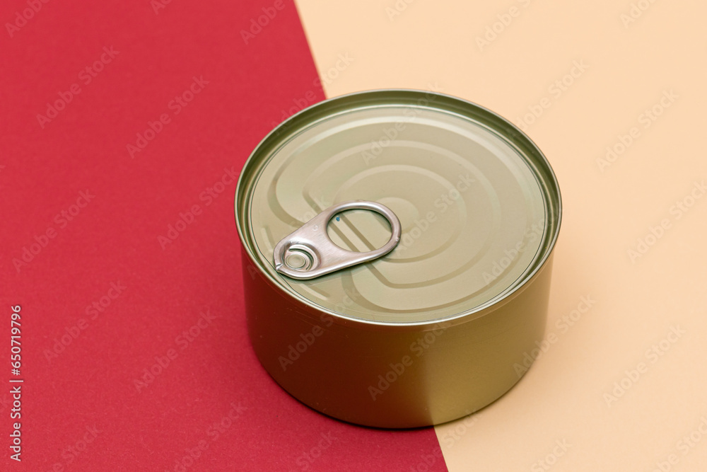 Unopened Tin Can with Blank Edge on Split Red and Beige Background ...