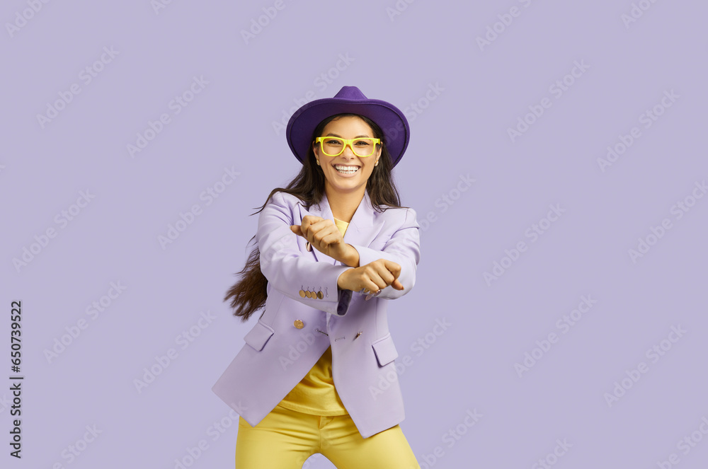 Cheerful and stylish young woman having fun dancing in gangnam style on ...