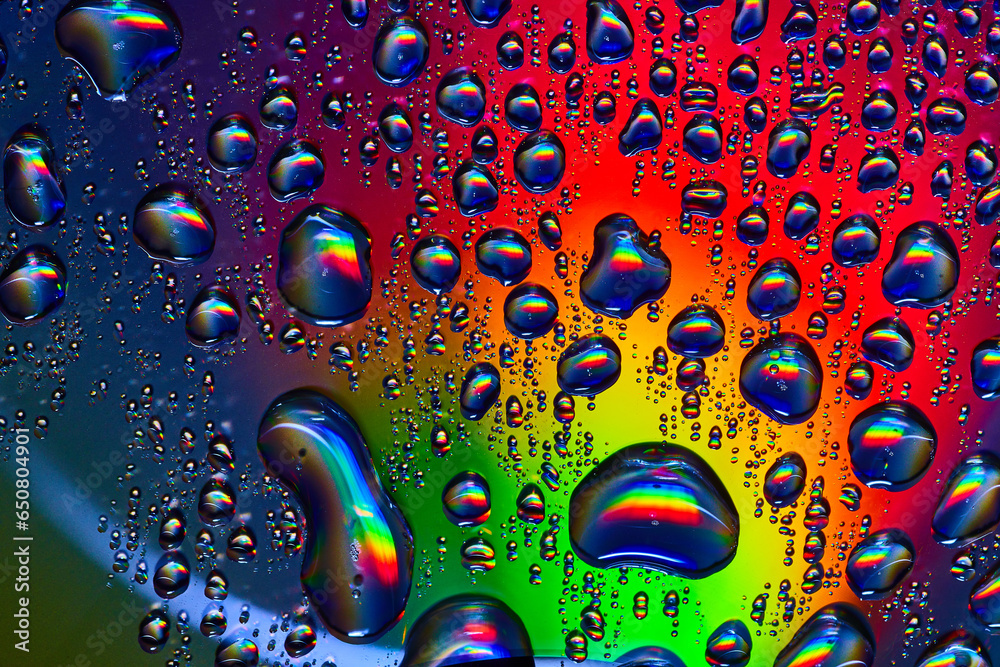 Fizzy odd shaped bubbles bursting across rainbow colored metallic ...