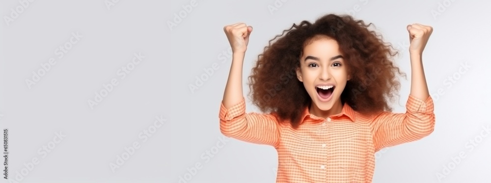 Cute little girl happy to get scholarship, clenches fists, accomplishes ...
