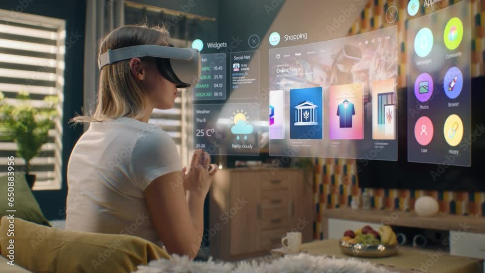 Woman in VR headset chooses clothes in online store chilling at home ...