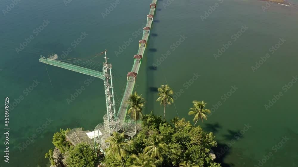 Top down fly past over Bacuag Hanging Bridge and Octopus Islet ...