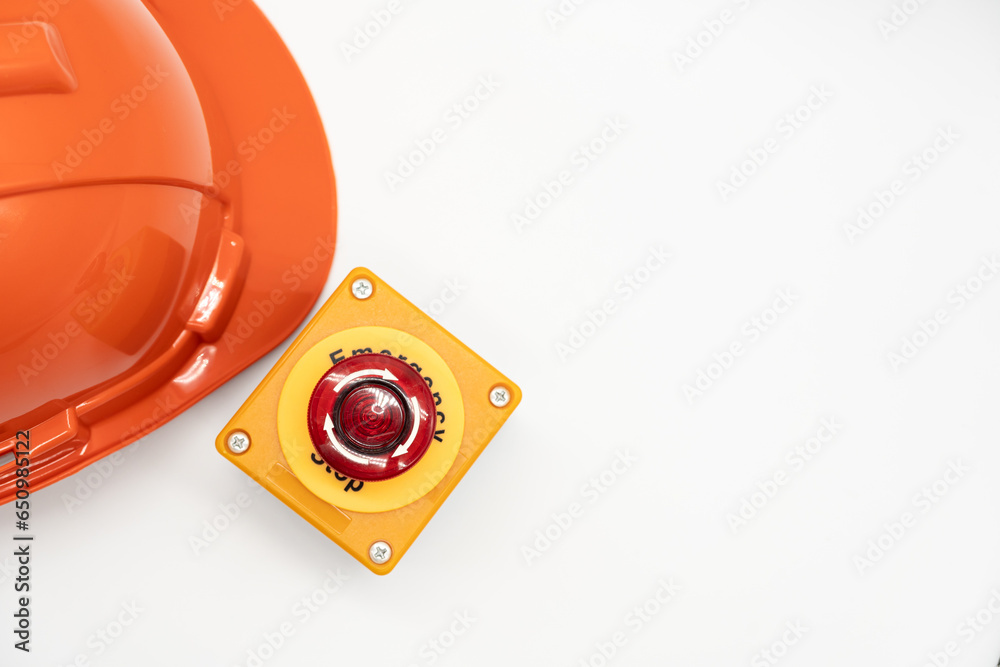 Orange safety hat with Emergency Stop Button isolated on white ...