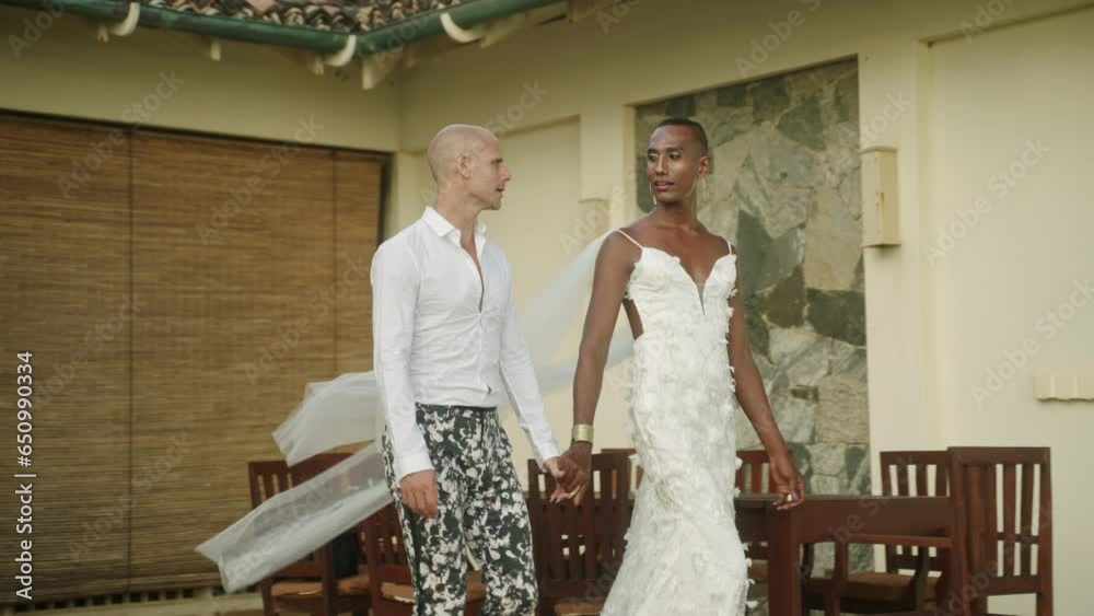 Biethnic married male walk around luxury villa on tropical island after ...