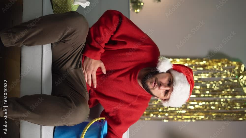 A man suffering from nausea and vomiting after a Christmas party. Food ...