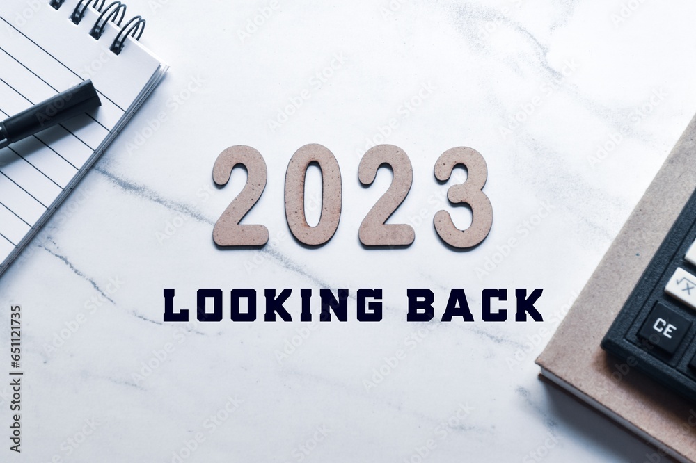 Wooden 3d numbers 2023 with inscrption looking back on white background ...