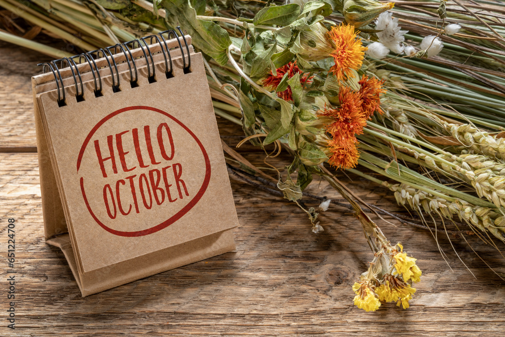 Hello October welcome note in a spiral desktop calendar with floral ...