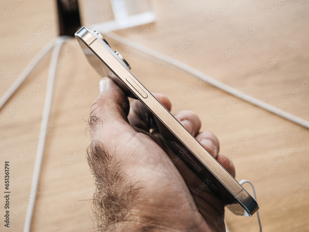 Paris, France - Sep 22, 2023: A male hand holds the latest iPhone 15 ...