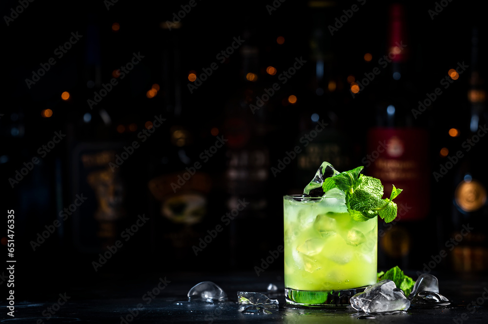 Green Negroni cocktail drink with dry gin, aperitif, gentian liqueur ...