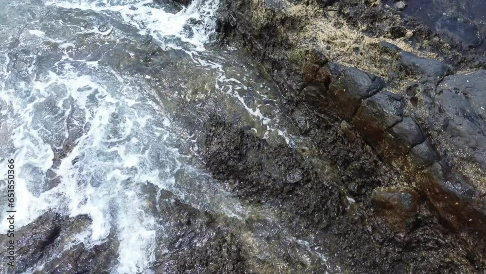 Drone view of big atlantic ocean waves meet the rocky coasts of the ...