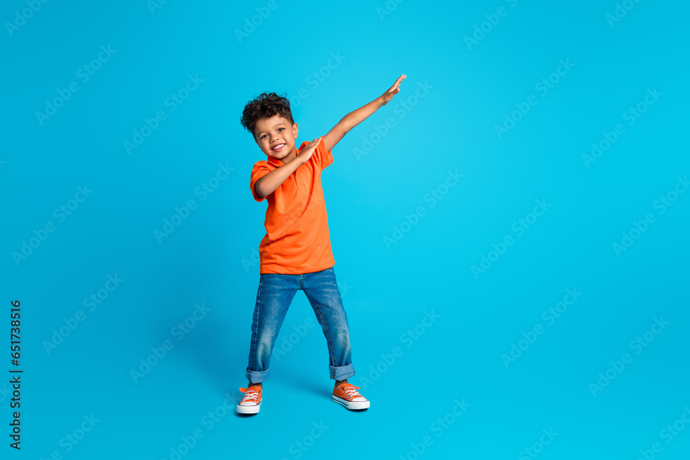 Full length body cadre of small boy kindergarten moves dab sign have ...