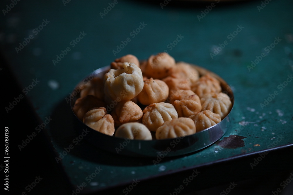 Beautiful Plate with the fried Modak. Sweets for Lord Ganesha. Prasad ...