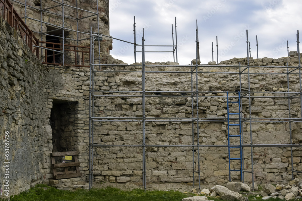 Carrying out restoration work in the ancient medieval fortress. Metal ...