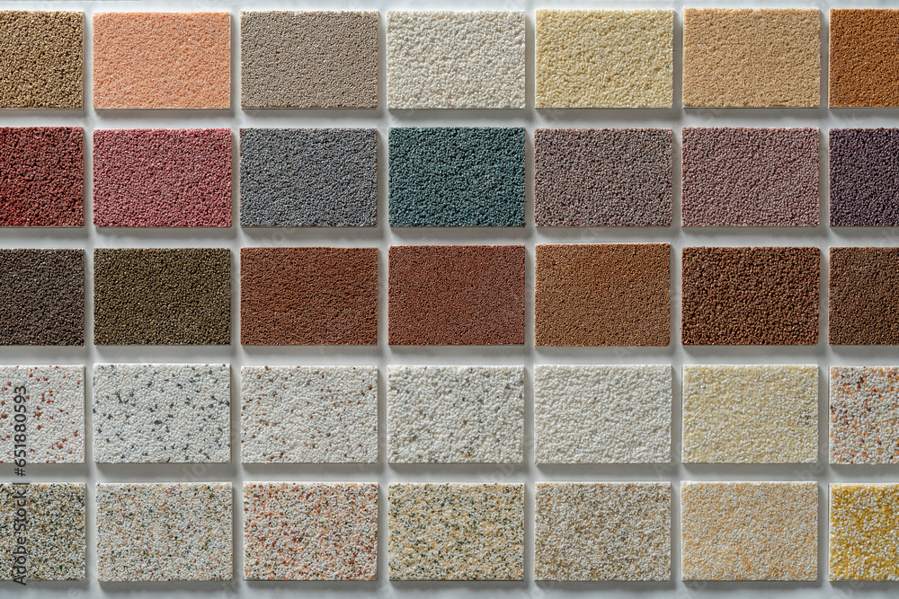 Samples of multi colored plaster for the decoration of the facade and ...