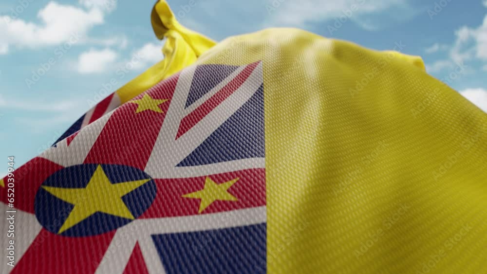 Wavy flag of Niue blowing in the wind in slow motion. Waving official ...