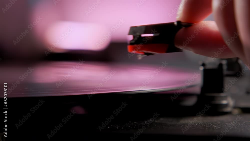 Close up shot footage of hands placing the vintage turntable on a ...