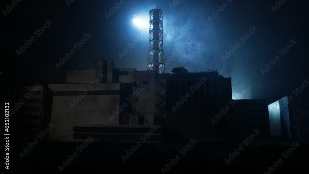Creative artwork decoration. Chernobyl nuclear power plant at night ...