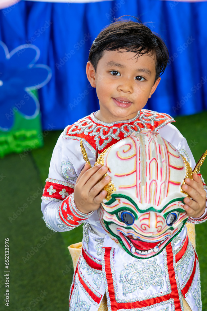 Happy and smile Asian boy wearing Hanuman Khon. Hanuman is Thailand ...