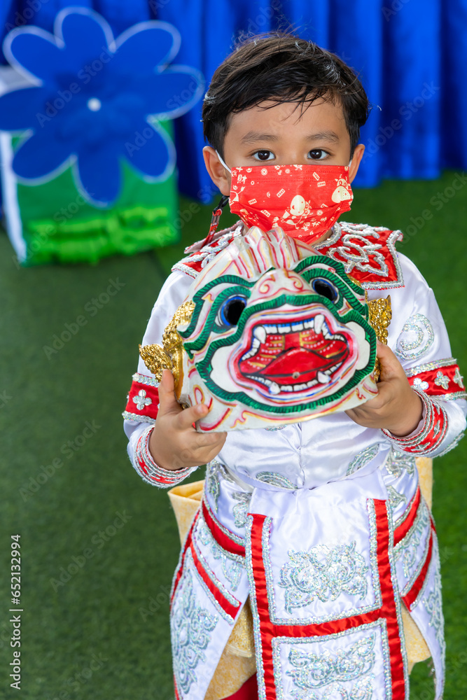 Happy and smile Asian boy wearing Hanuman Khon. Hanuman is Thailand ...