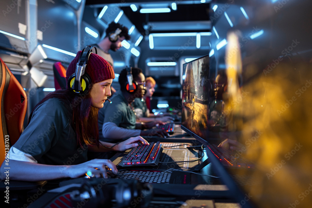 Diverse female esports team playing a video game and competing in an ...