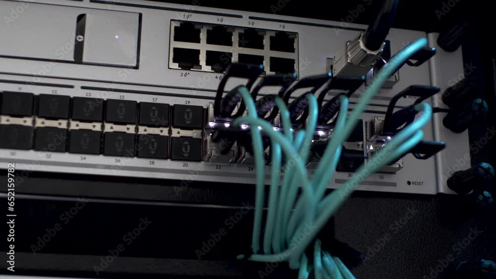 LAN Cables Plugged In Network Server Rack With White Blinking Lights ...