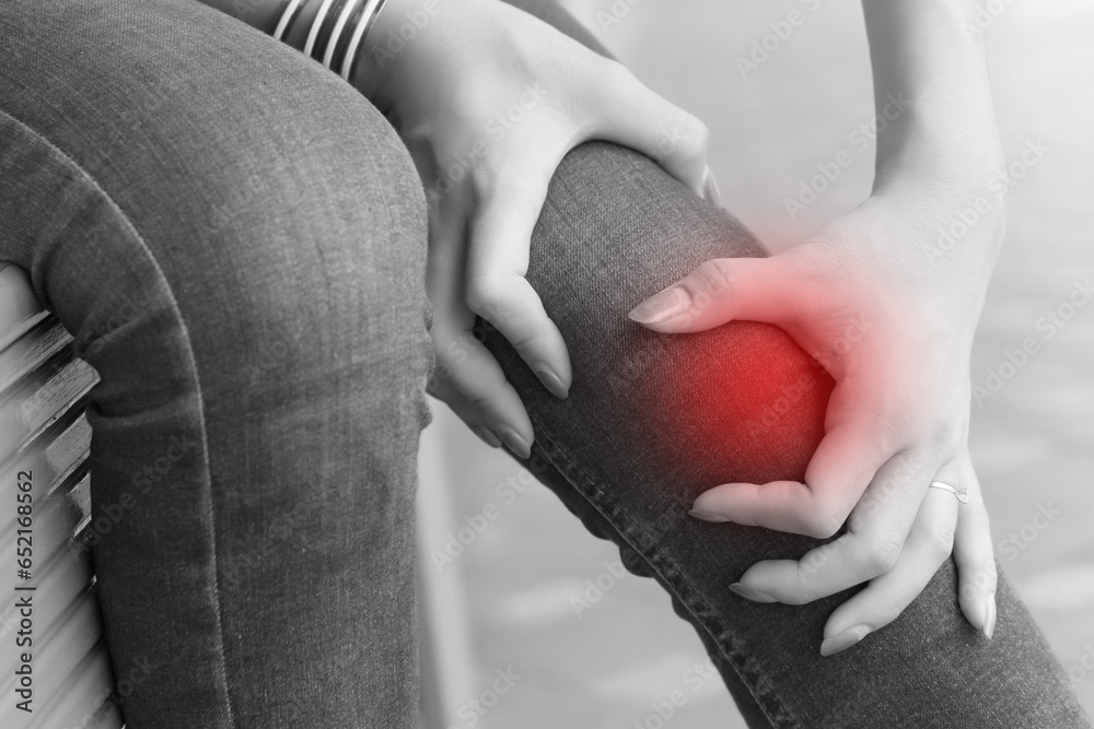 woman with knee joint pain symptoms, closeup hand holding injured knee ...