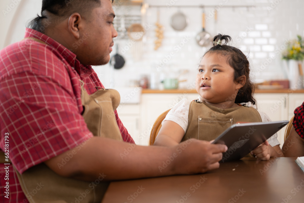 A plus-size family with a father wearing a prosthetic leg, is happily ...