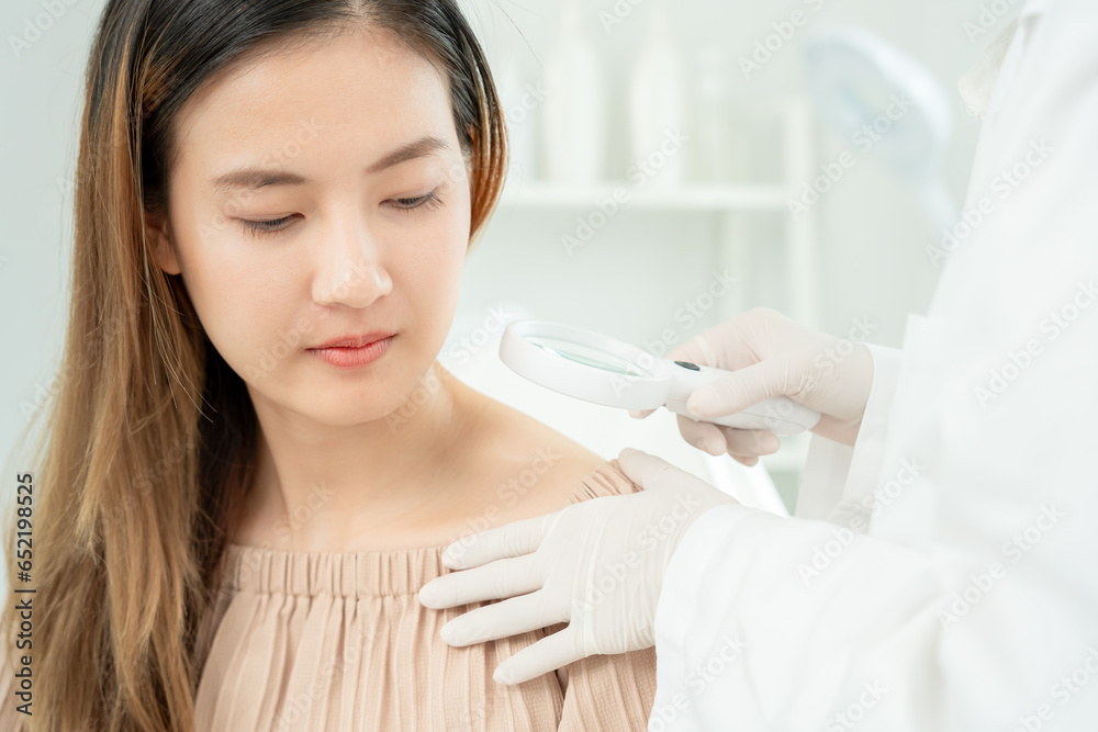 skin problem and beauty of asian girl. Dermatologist use magnifying ...