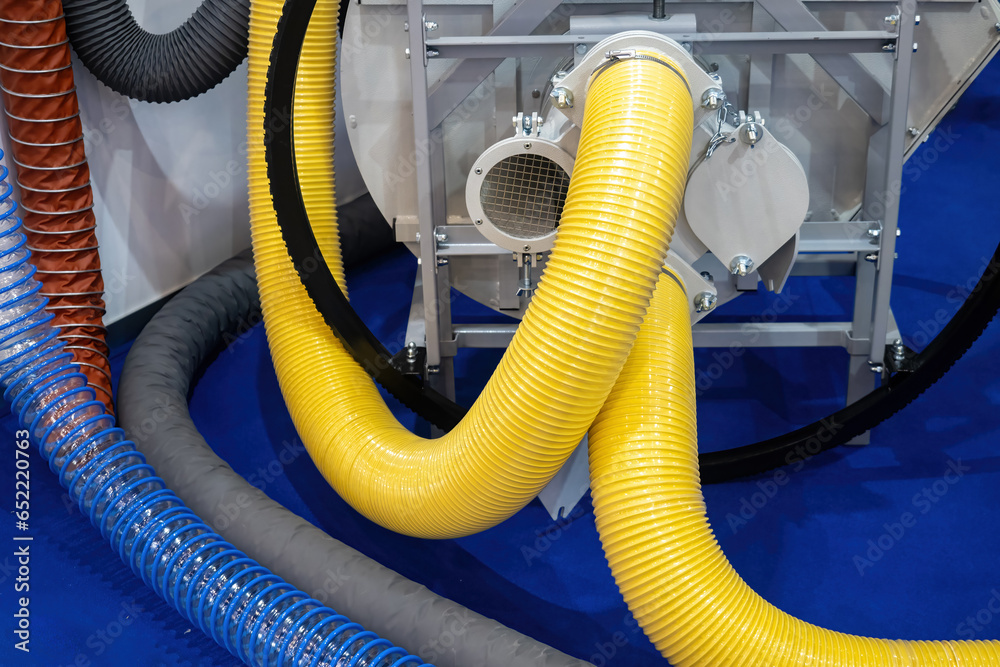 Hoses are connected to production equipment. Multi-colored flexible ...