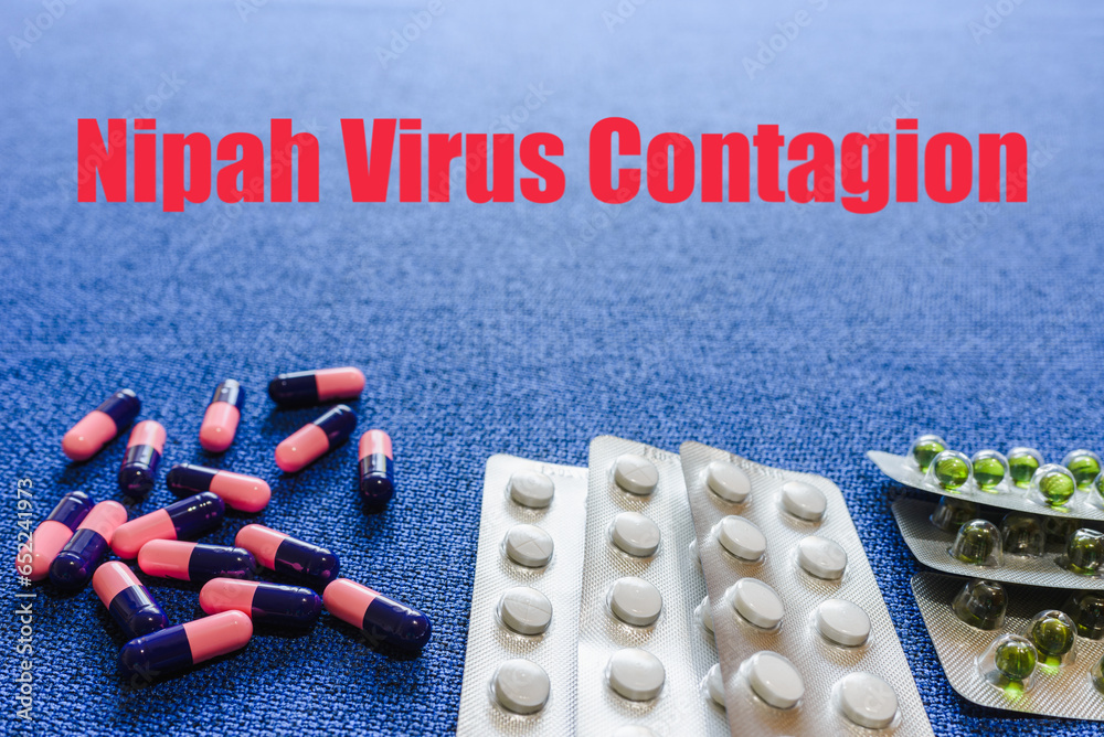 Nipah virus concept.A blue background with the inscription NIPAH VIRUS ...