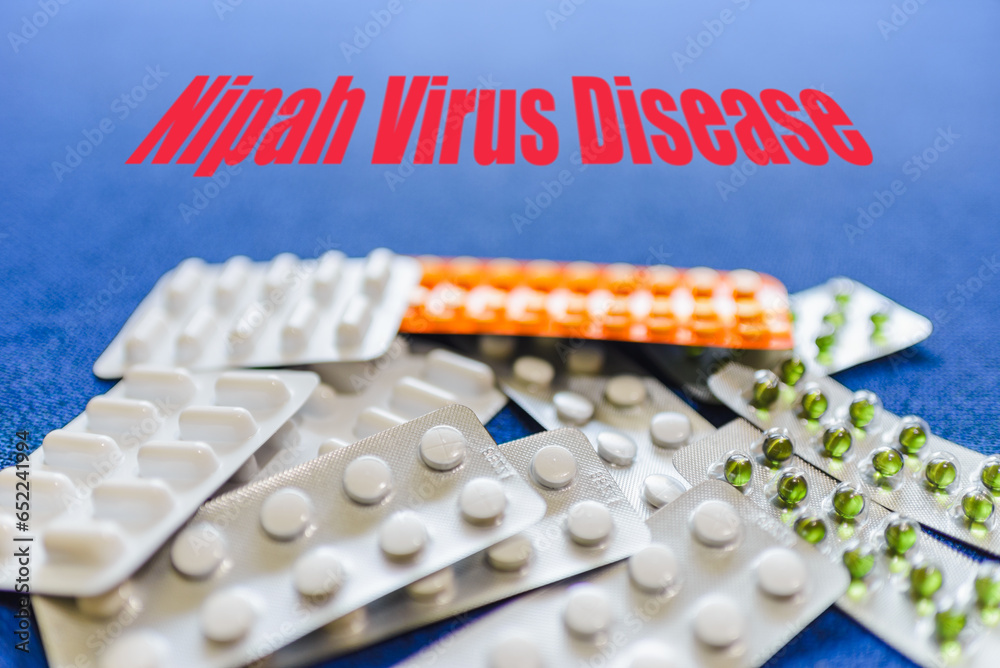 Nipah virus concept.A blue background with the inscription NIPAH VIRUS ...