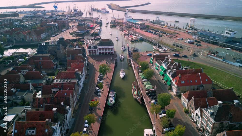 Aerial view of water in Harlingen Bay, boats, houses by the canal ...