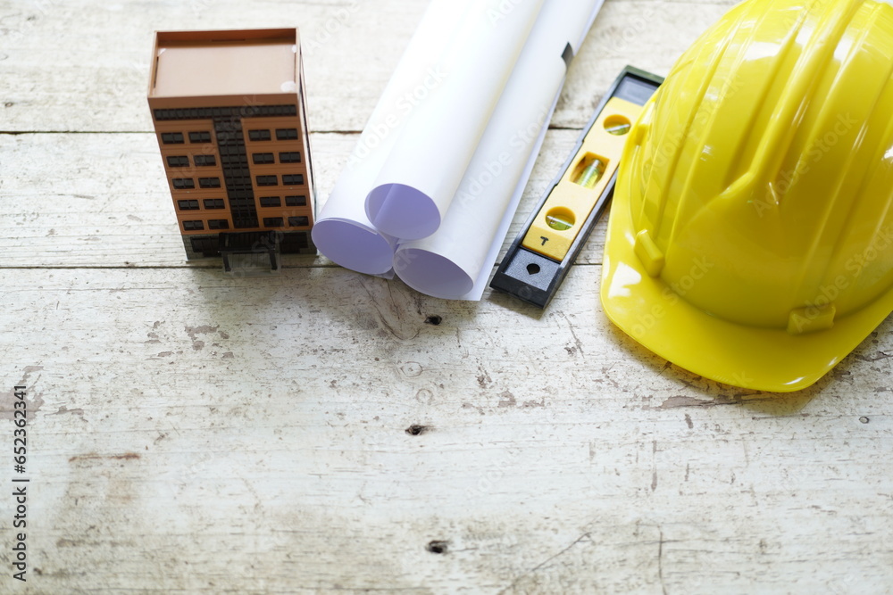 Set of professional construction tools and safety helmet on a work ...
